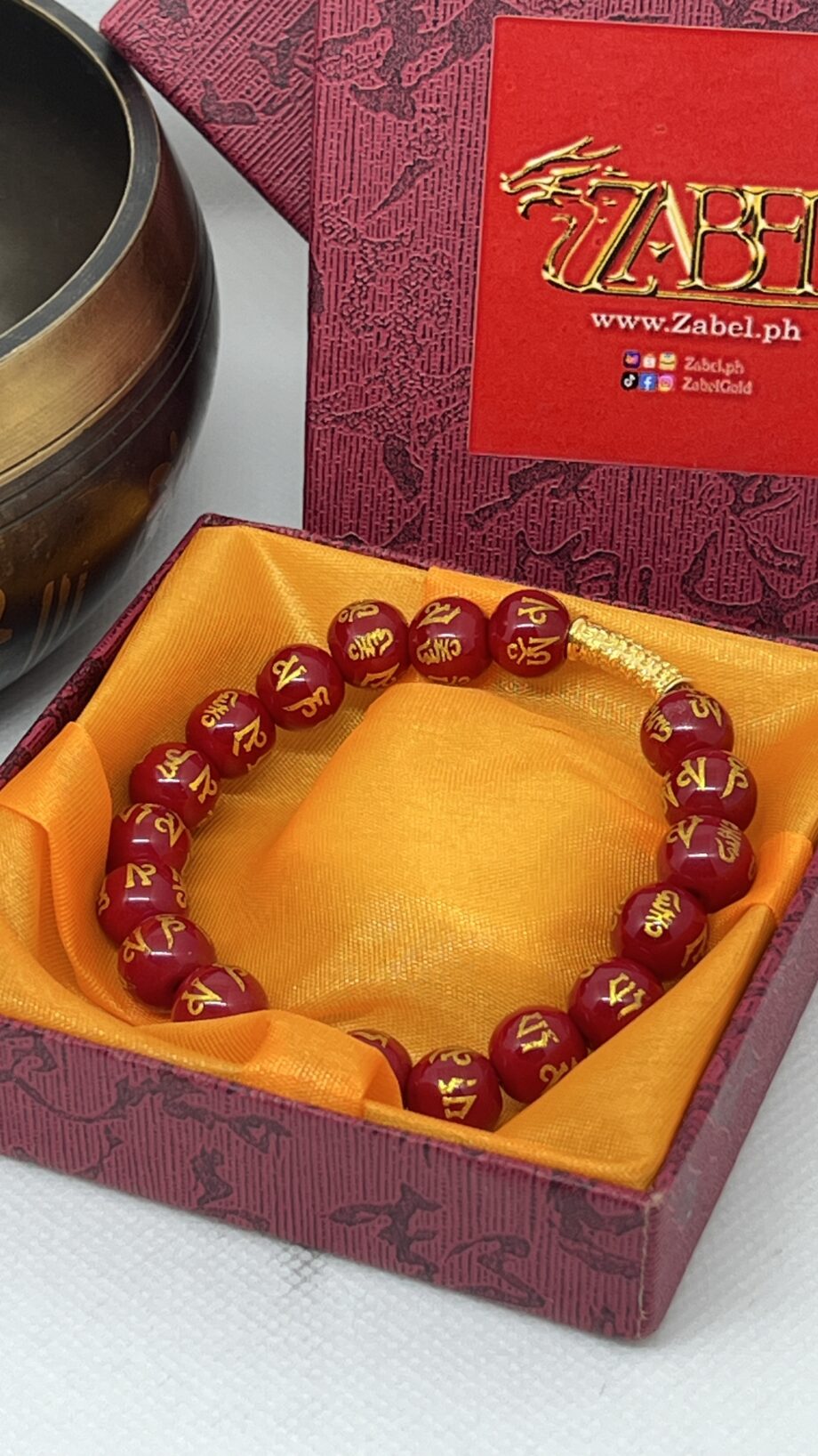 18k Gold Baifu charm. Red bead with mantra prayer. Onyx