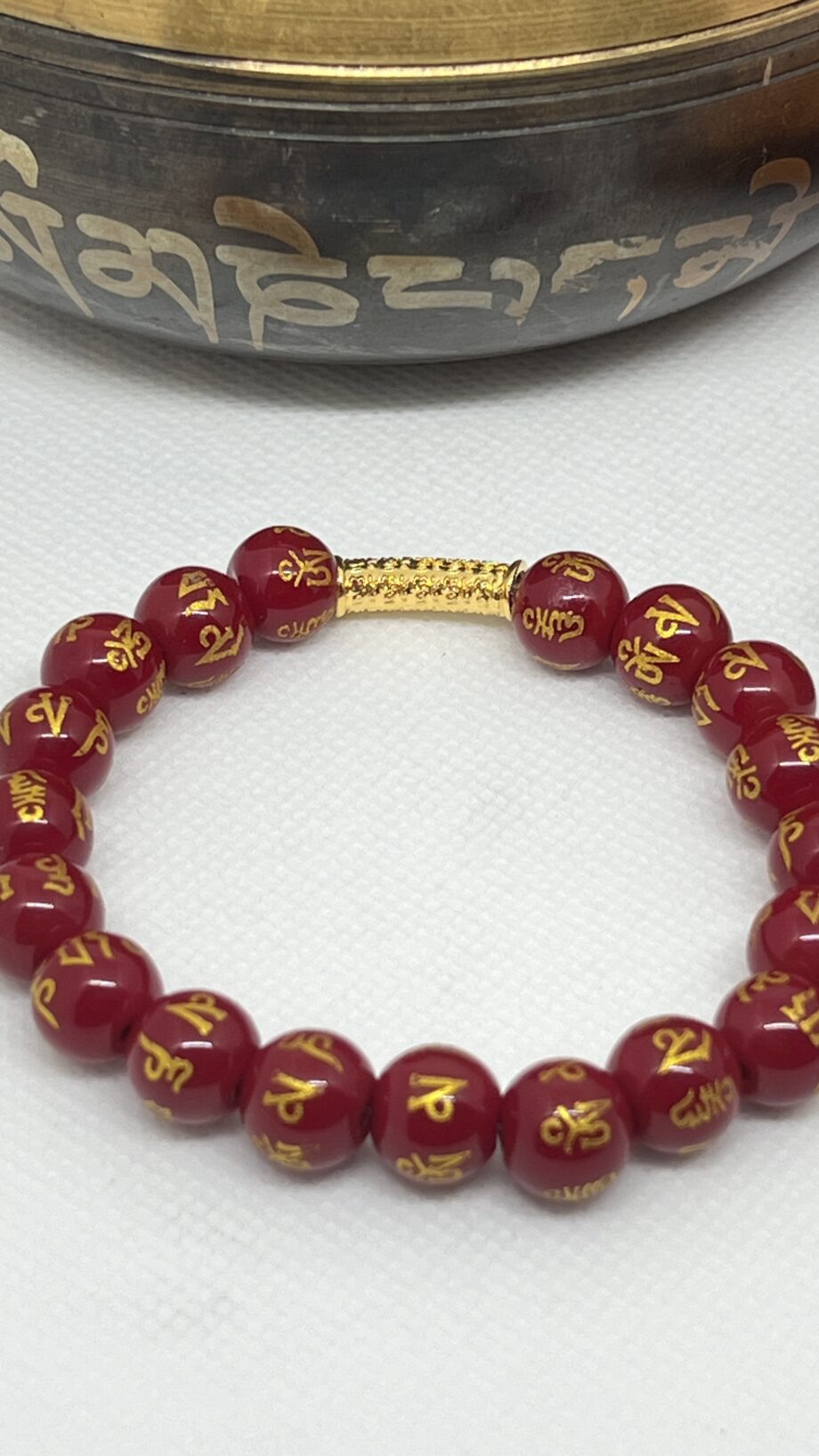 18k Gold Baifu charm. Red bead with mantra prayer. Onyx